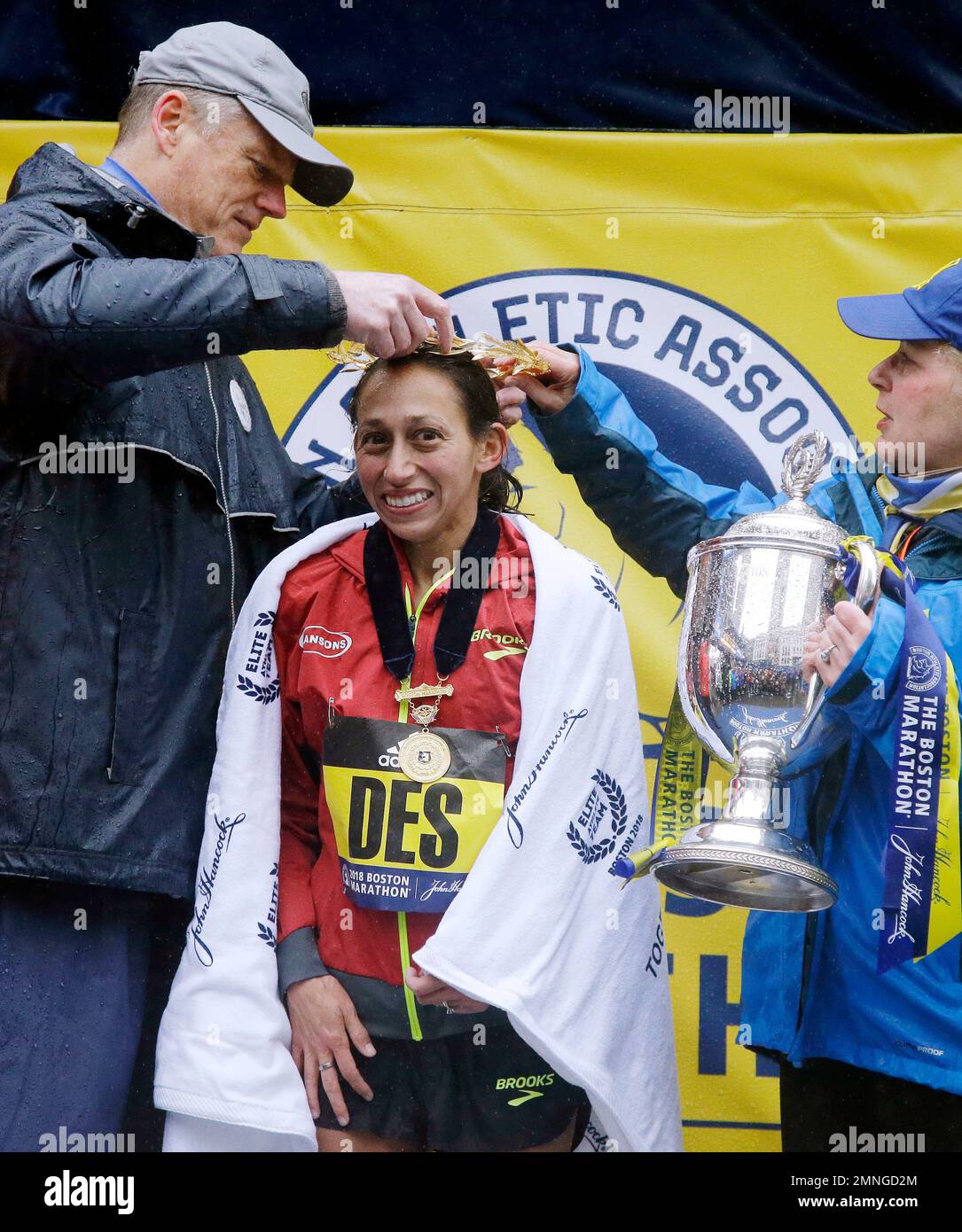Massachusetts Gov. Charlie Baker, left, places the victor's crown on ...