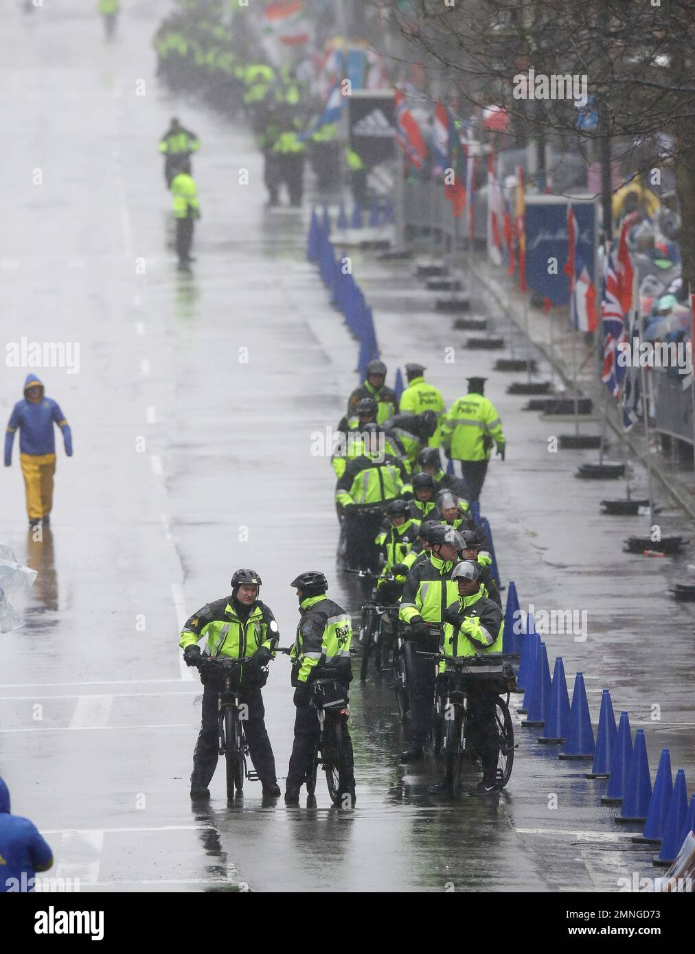 Boston police officers on bicycles gather near the finish line during ...