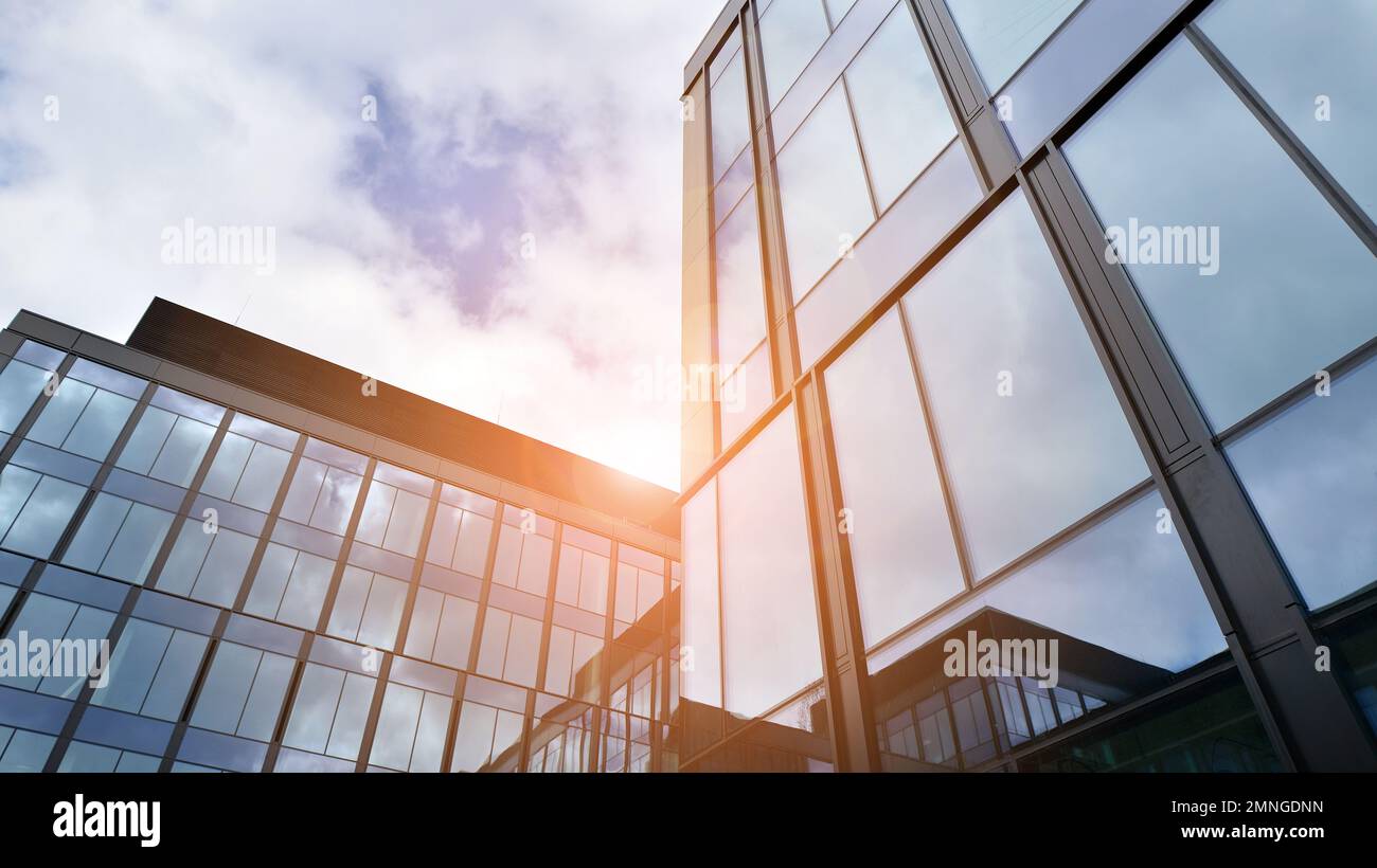 Abstract closeup of the glass-clad facade of a modern building covered ...