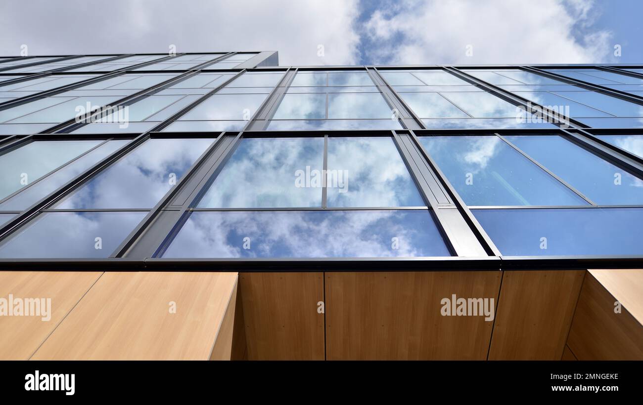 Abstract closeup of the glass-clad facade of a modern building covered ...