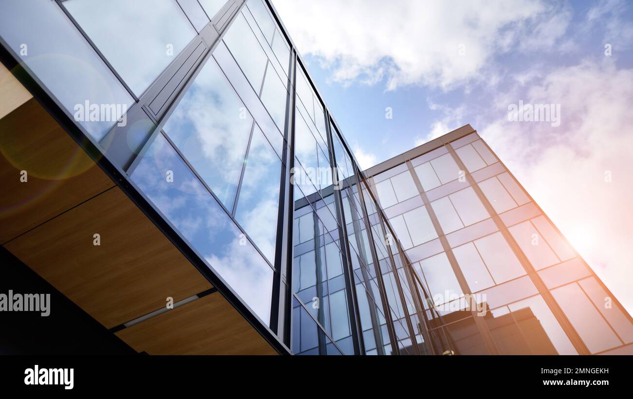 Abstract closeup of the glass-clad facade of a modern building covered ...