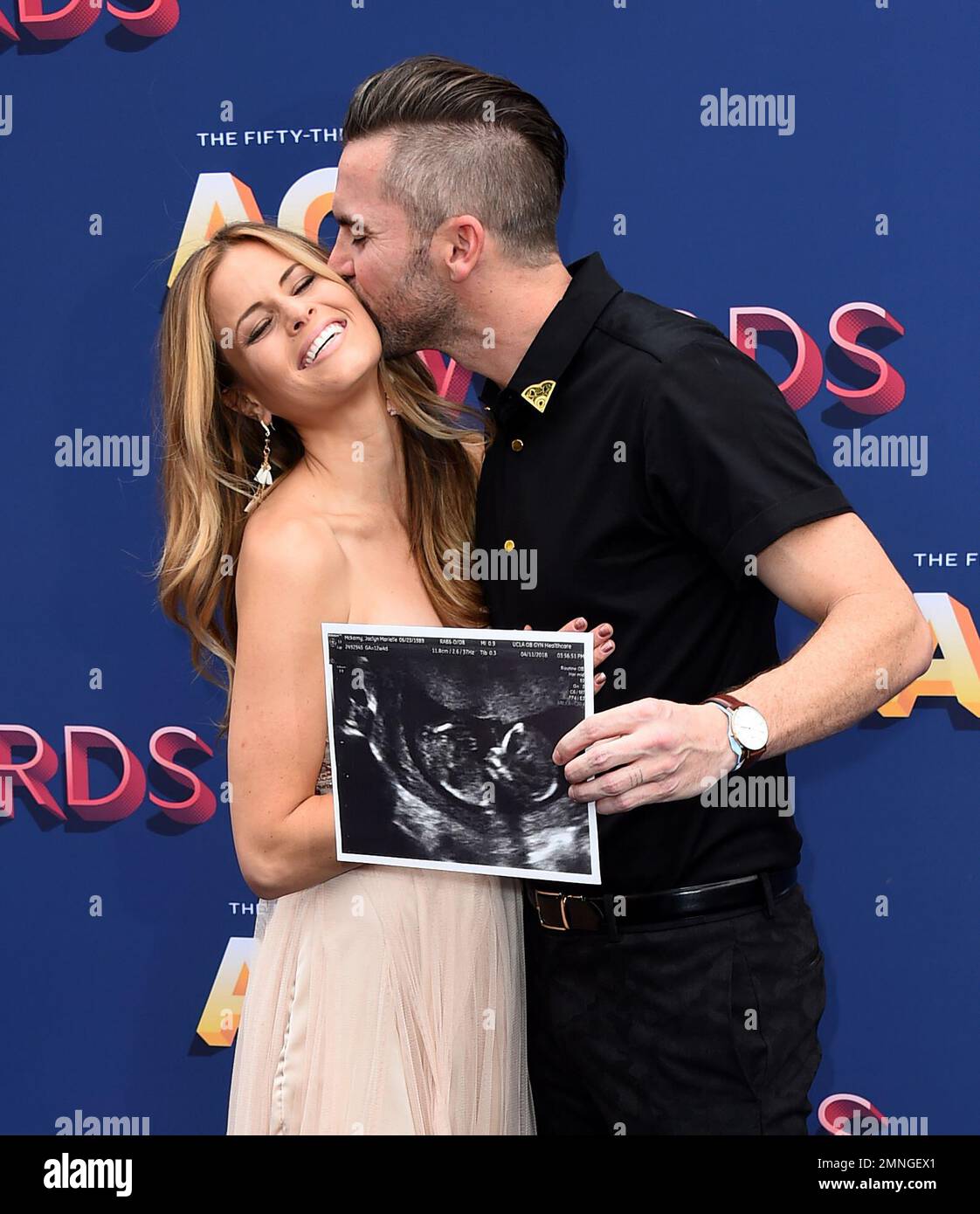 Marielle McKamy , left, and TK McKamy show a sonogram as they arrive at ...