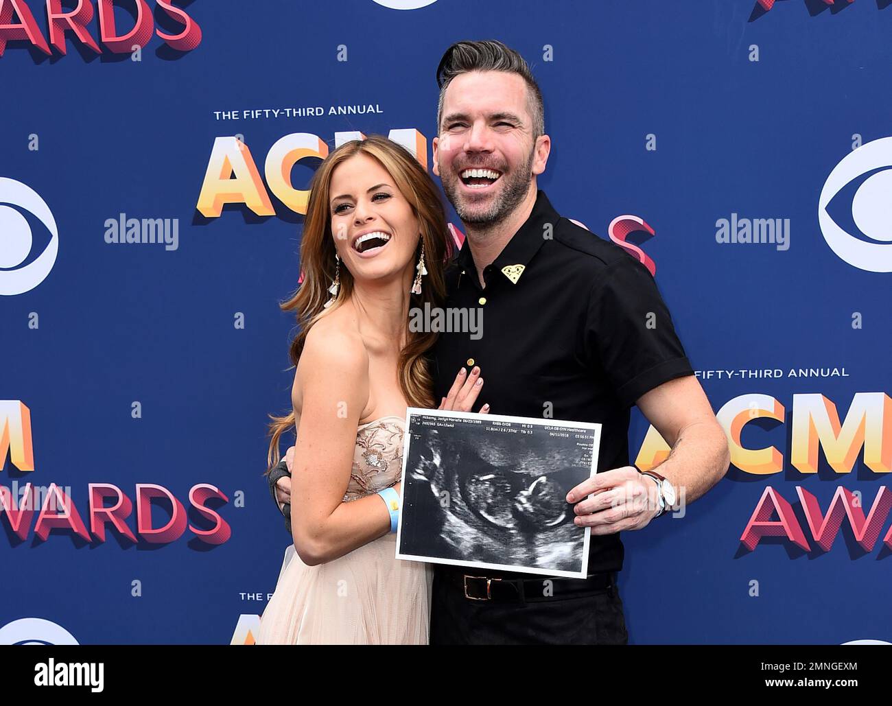 Marielle McKamy , left, and TK McKamy show a sonogram as they arrive at ...