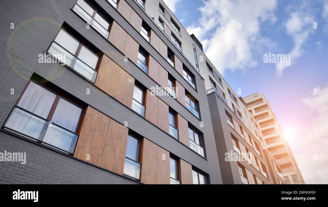 Futuristic square architecture of apartment building. Real estate with ...