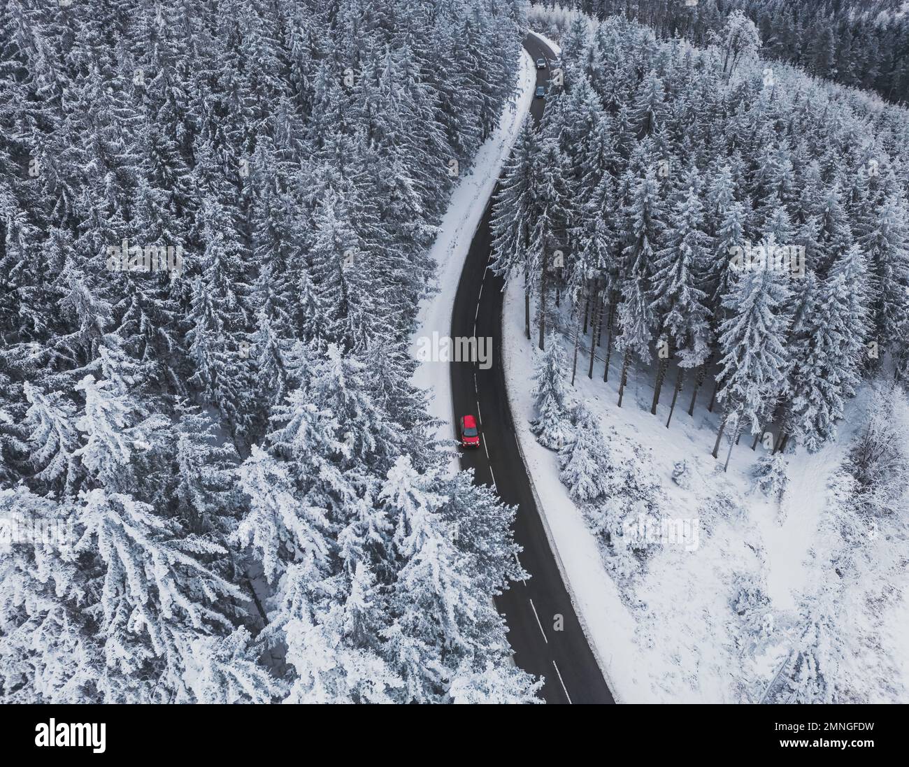 Red car winter road aerial hi-res stock photography and images - Alamy