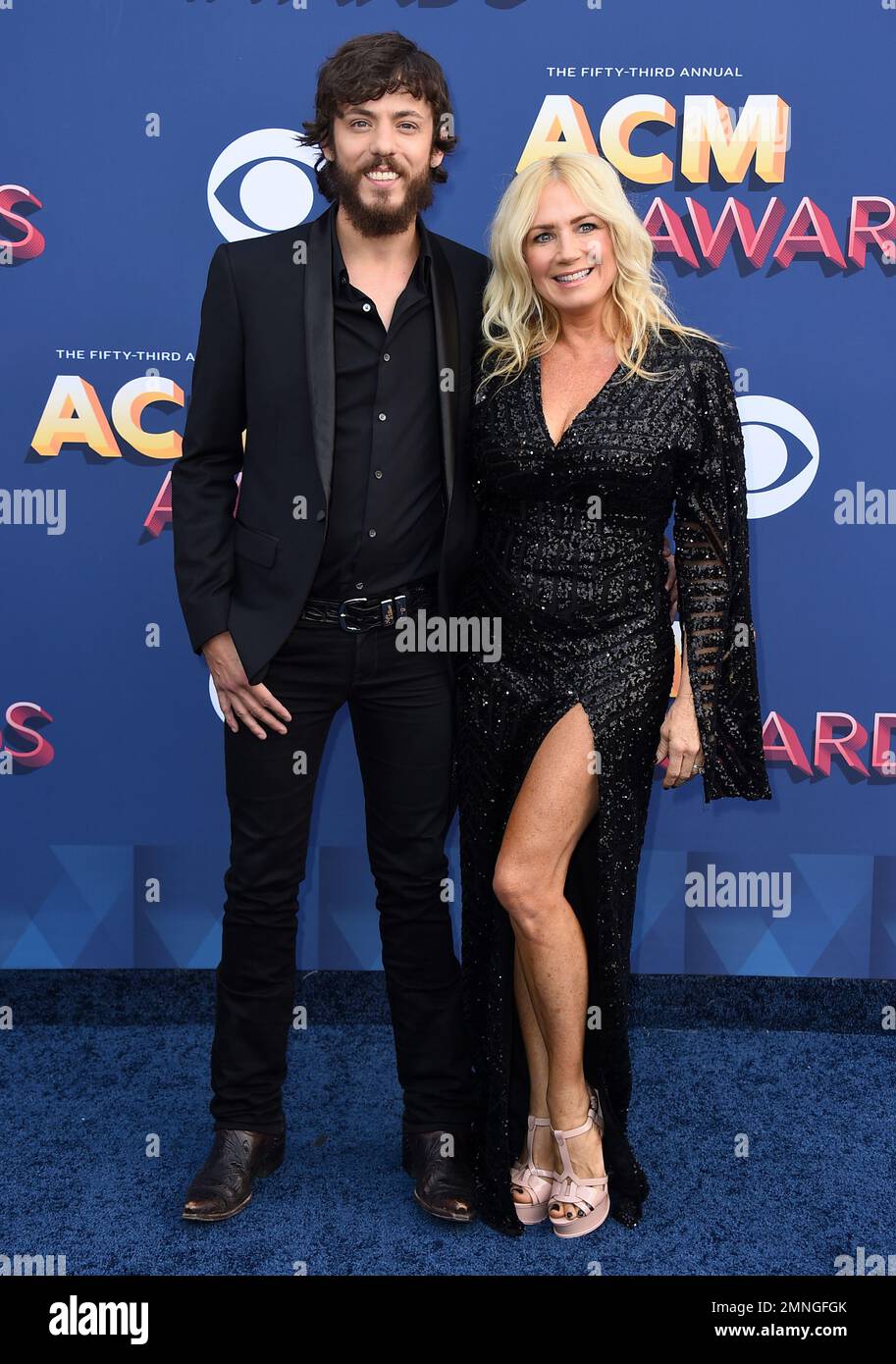 Chris Janson, left, and Kelly Lynn arrive at the 53rd annual Academy of ...