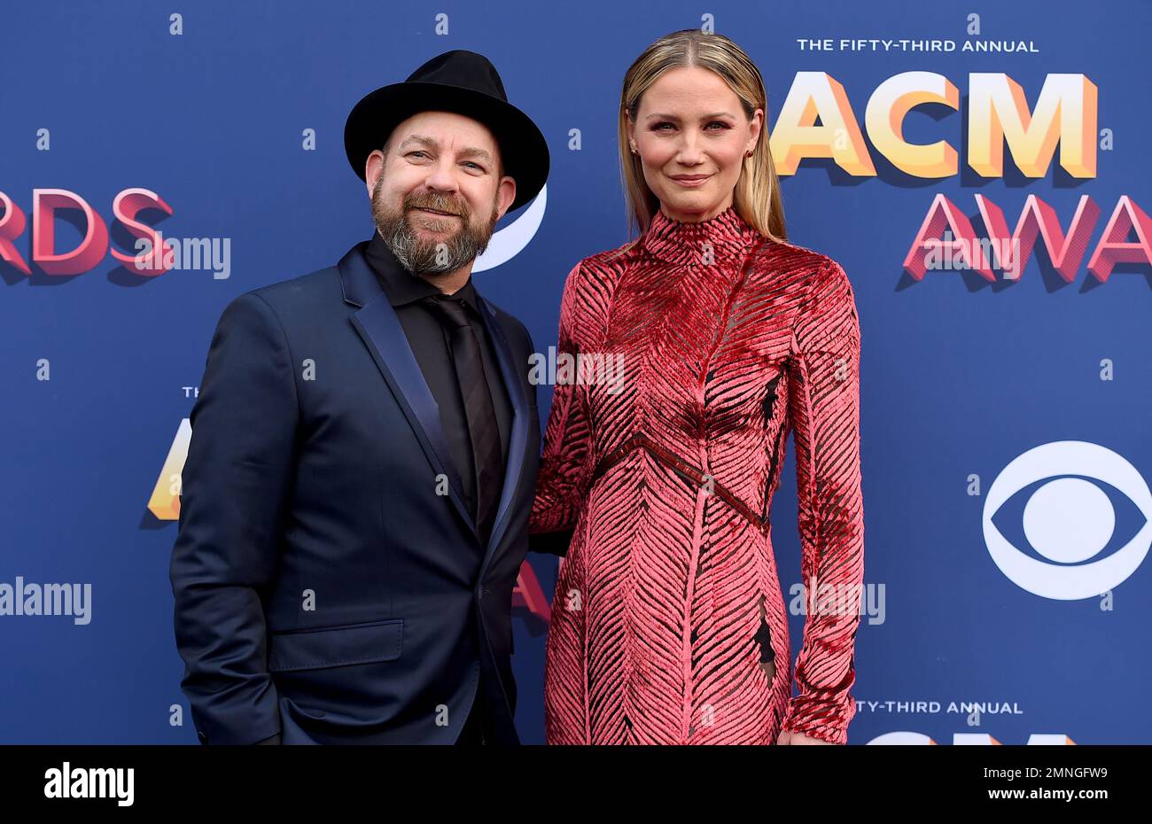 Kristian Bush, left, and Jennifer Nettles, of Sugarland, arrive at the ...
