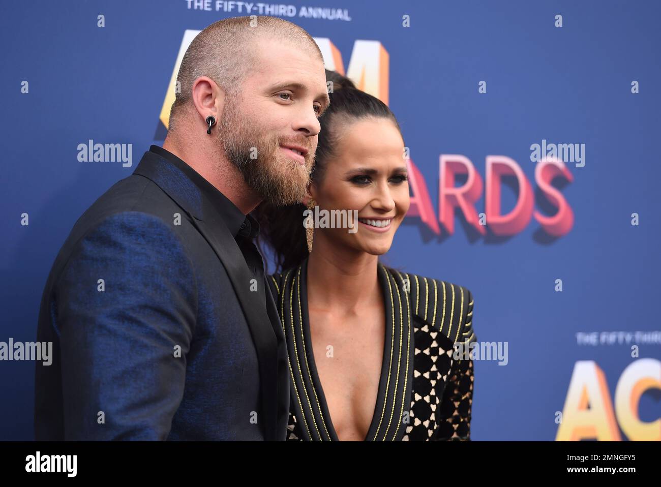Brantley Gilbert, left, and Amber Cochran arrive at the 53rd annual ...