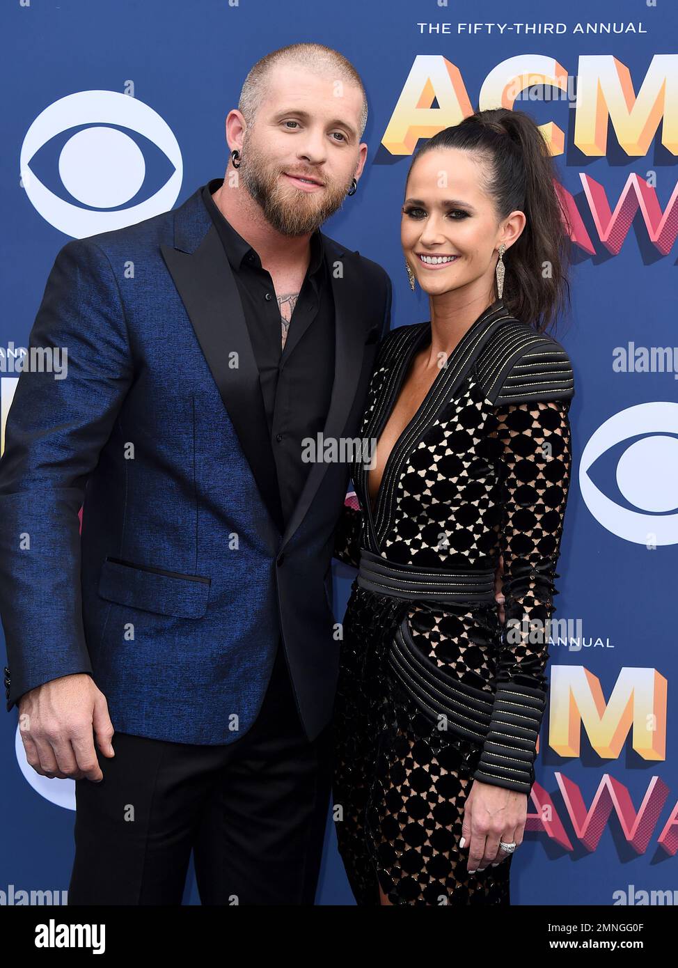 Brantley Gilbert, left, and Amber Cochran arrive at the 53rd annual ...