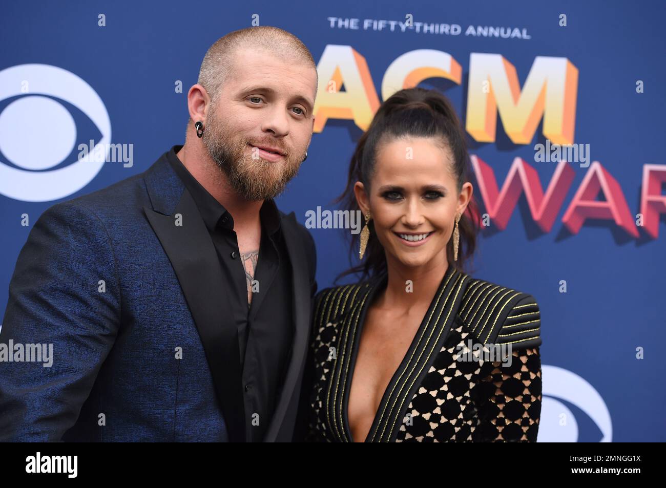 Brantley Gilbert, left, and Amber Cochran arrive at the 53rd annual ...