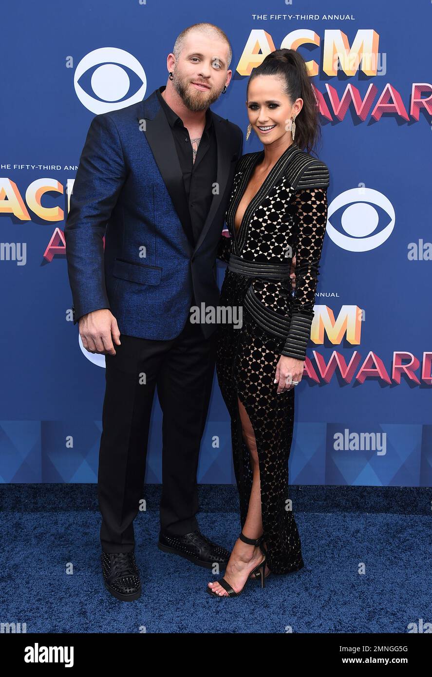 Brantley Gilbert, left, and Amber Cochran arrive at the 53rd annual ...