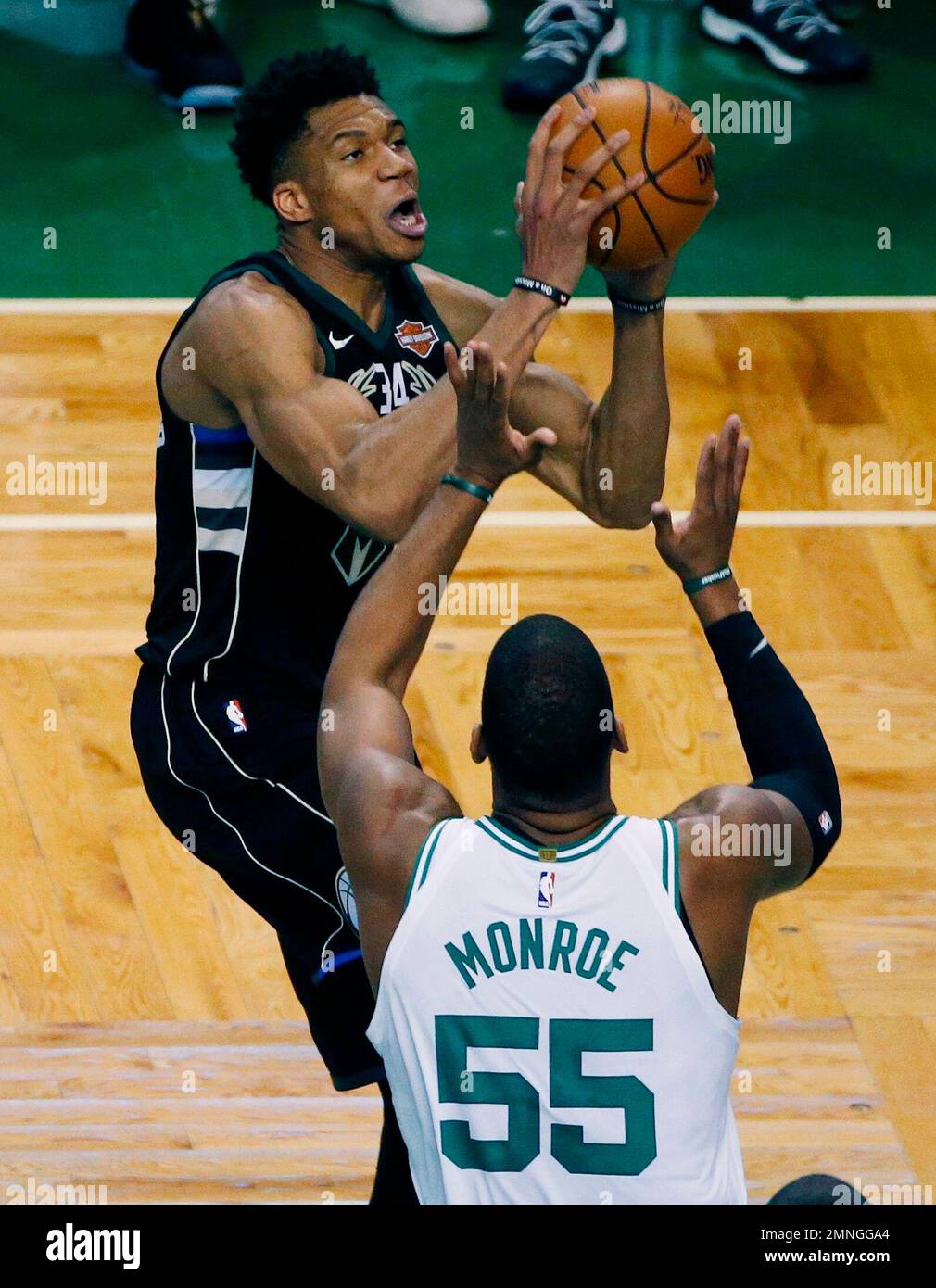 Milwaukee Bucks' Giannis Antetokounmpo (34) shoots over Boston Celtics ...