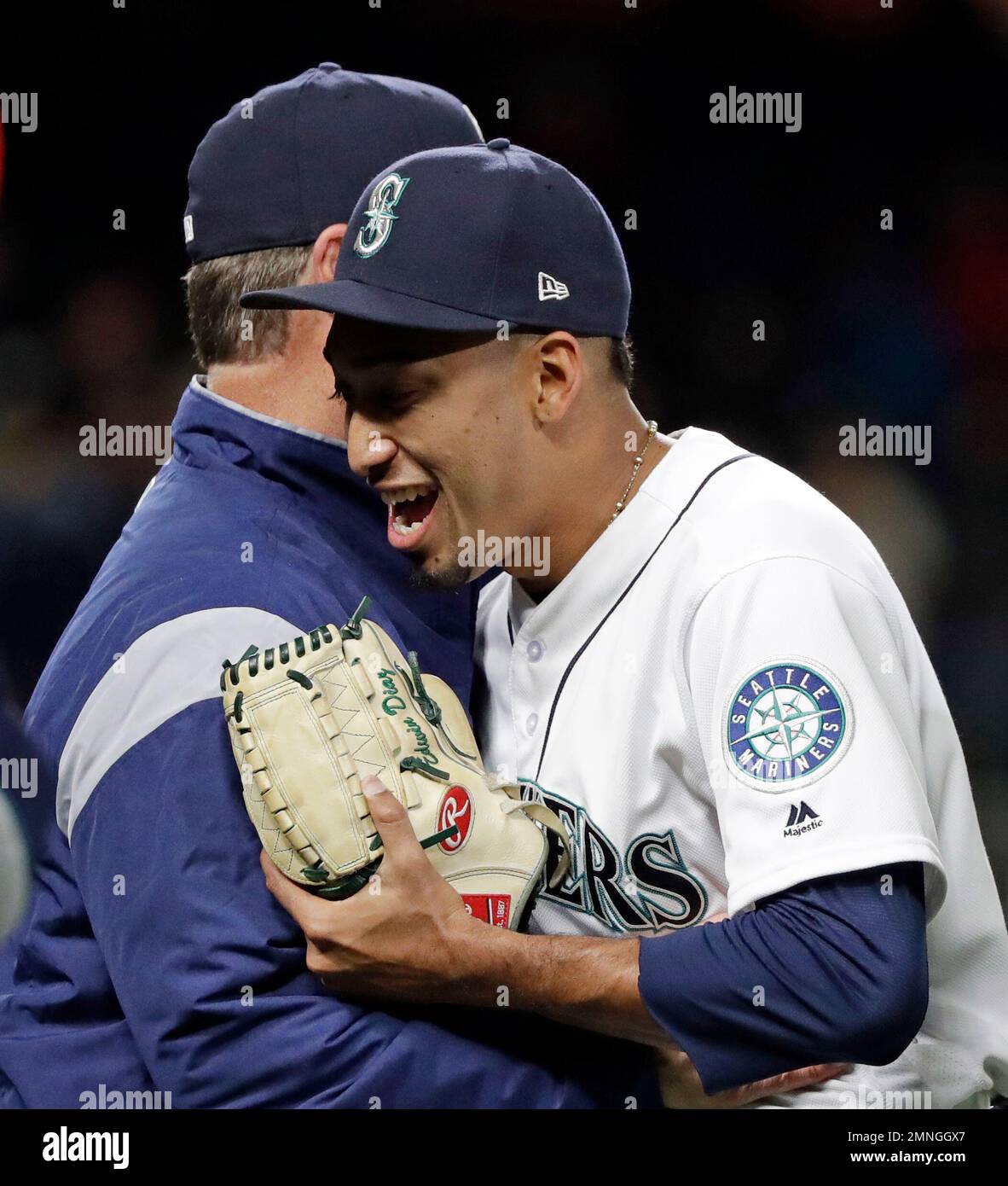 Seattle Mariners closer Edwin Diaz, right, is embraced by manager Scott ...