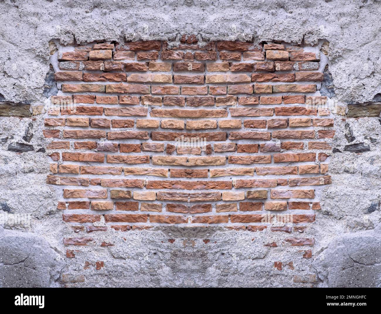 grey stucco wall with exposed stone, architectural textures Stock Photo ...