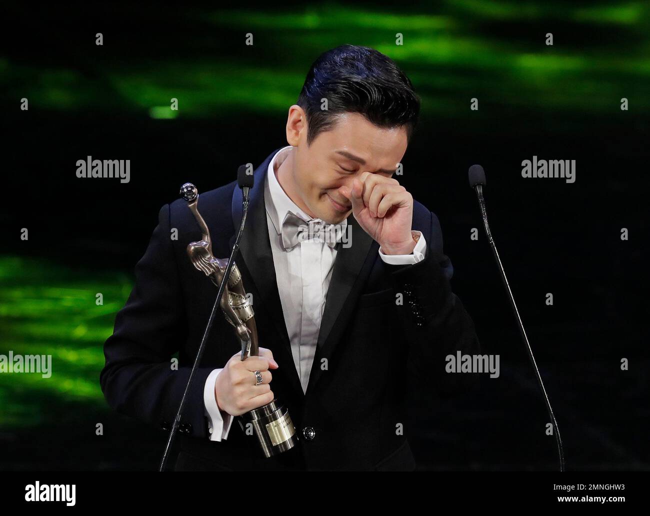 Hong Kong actor Ling Man Lung reacts after winning the Best New ...