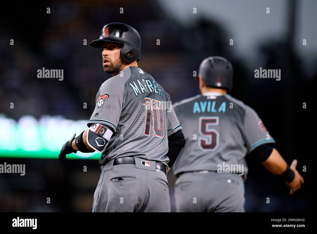 Arizona Diamondbacks' Deven Marrero, left, looks back toward the first ...
