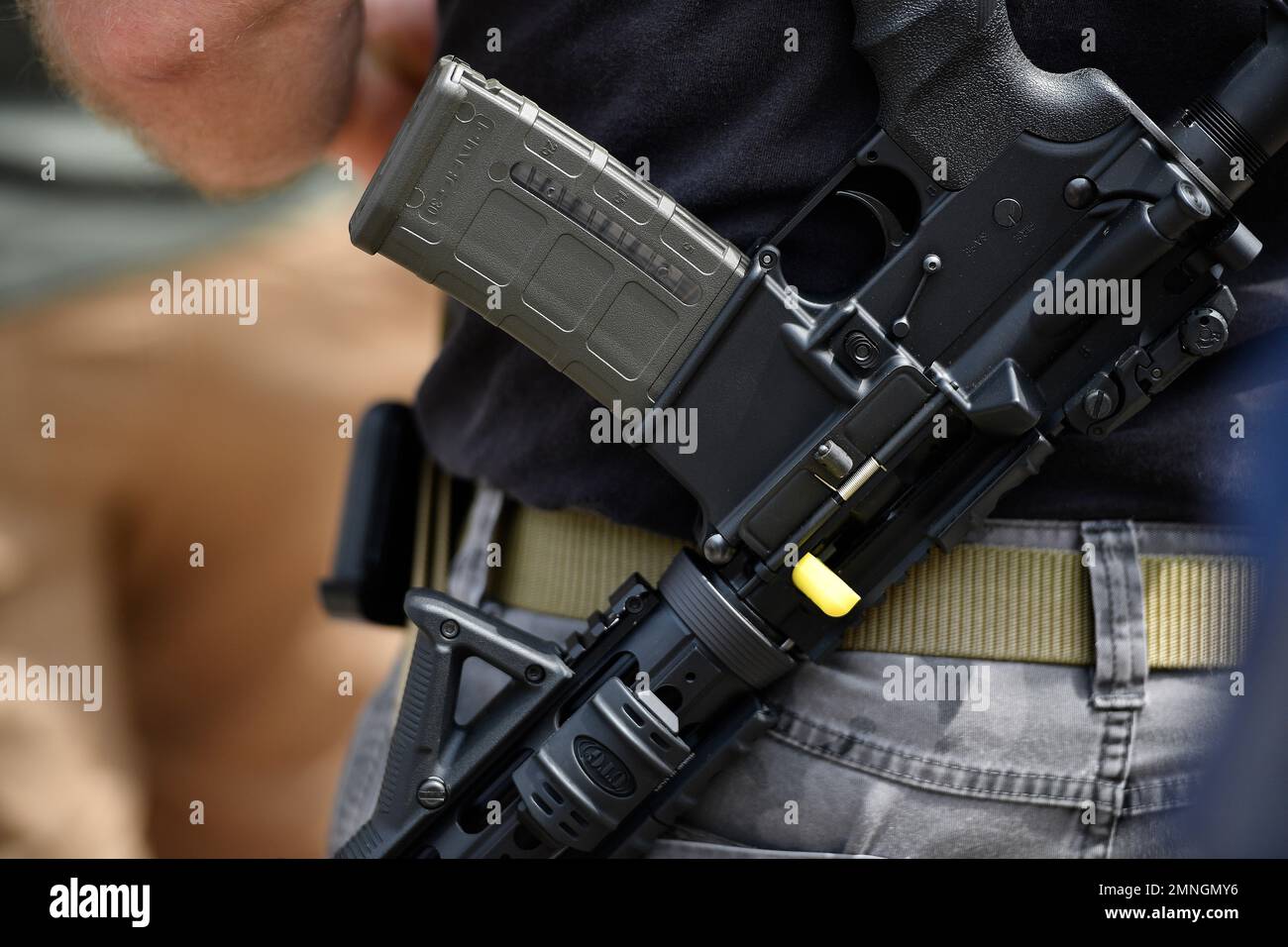 People participate in a gun-rights rally carrying their rifles at the ...