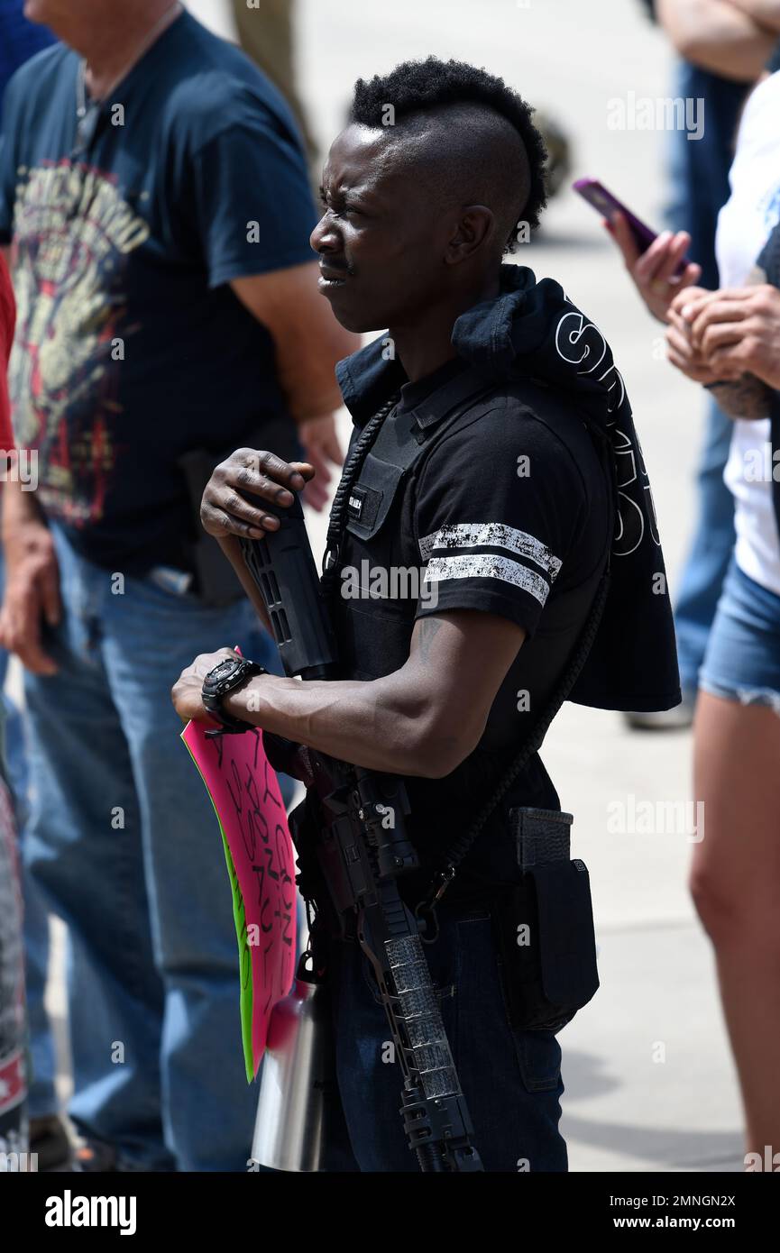 People participate in a gun-rights rally at the state capitol, Saturday ...