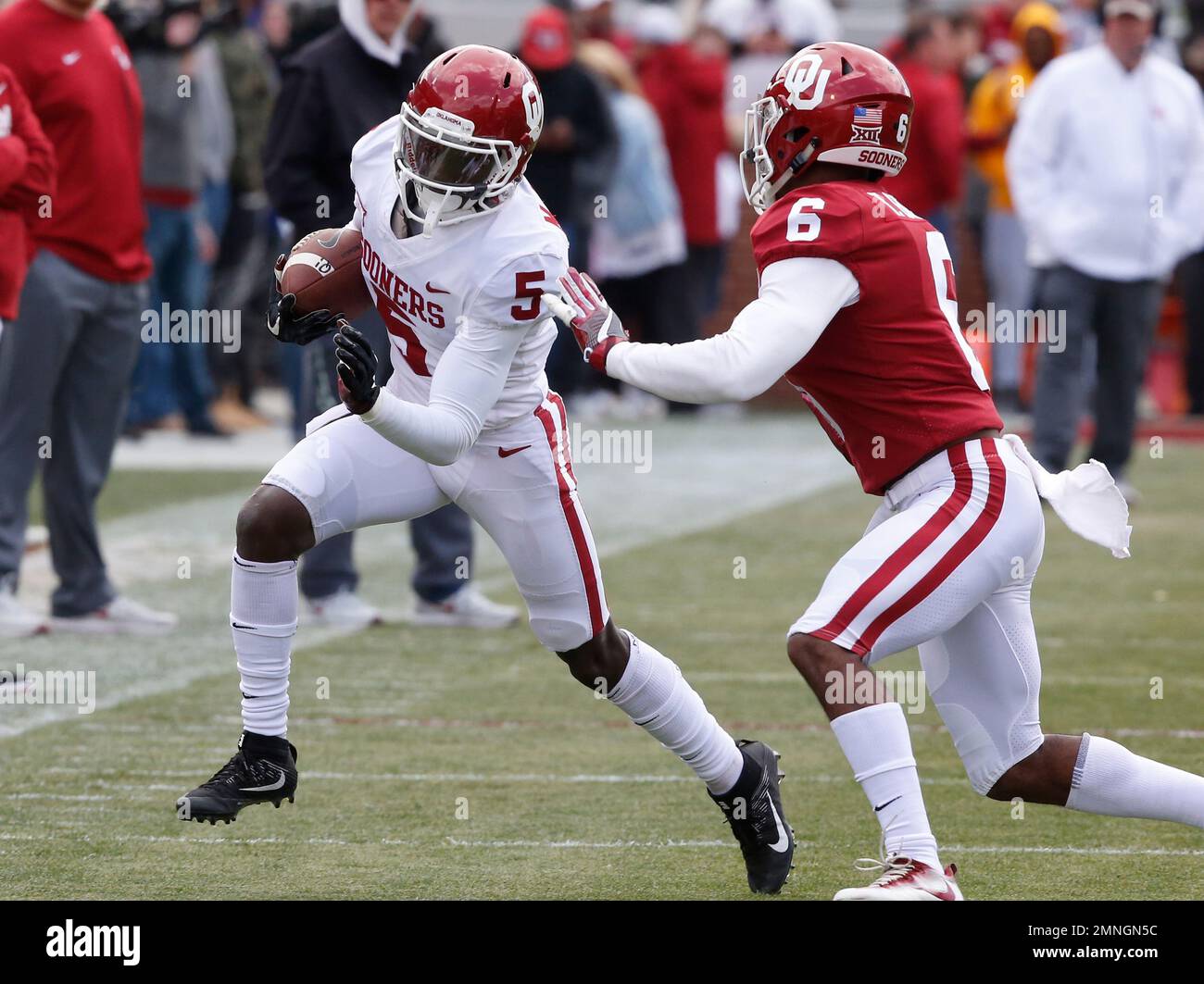 Oklahoma wide receiver Marquise Brown (5) moves around cornerback Tre ...