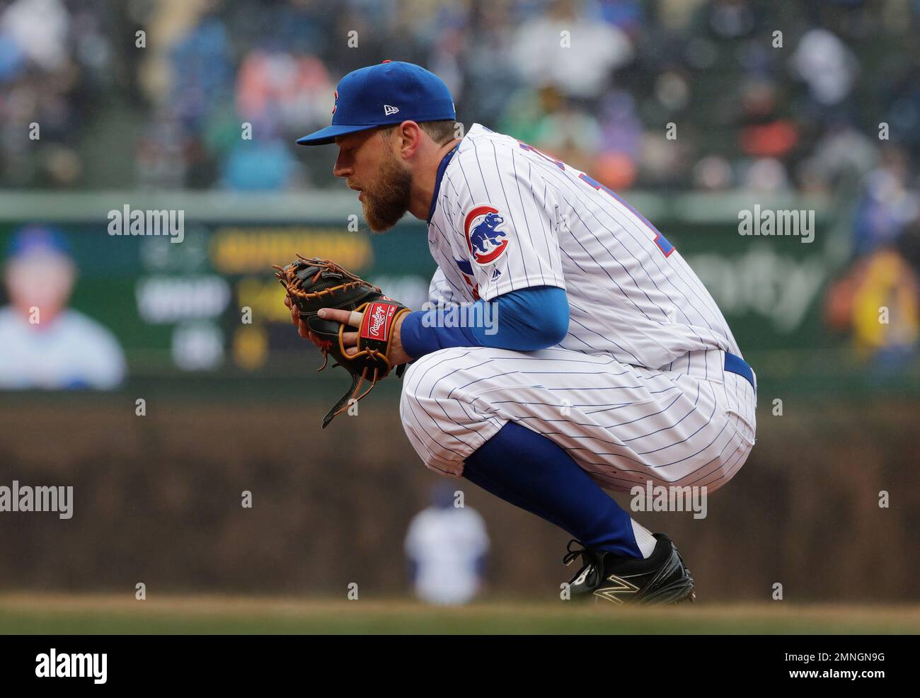 Chicago Cubs first baseman Ben Zobrist sits as he looks to home plate ...