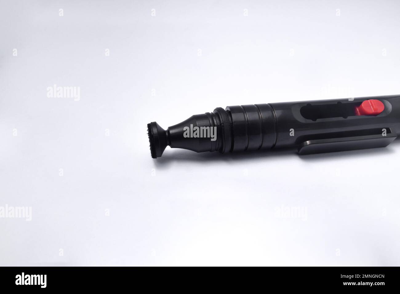 black and red lens pen, closeup and isolated on white background ...