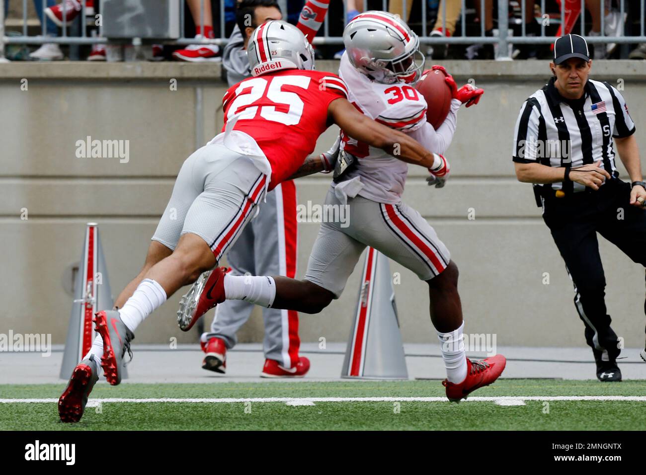 Ohio State defensive back Brendon White, left, tackles receiver Demario McCall during their NCAA ...