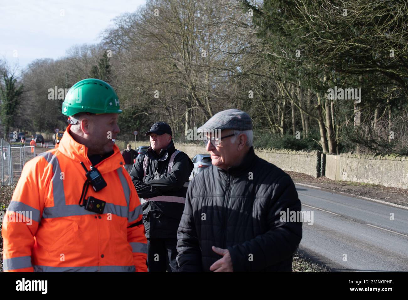 Hartwell, Aylesbury, UK. 30th January, 2023. A local resident (R) looks ...