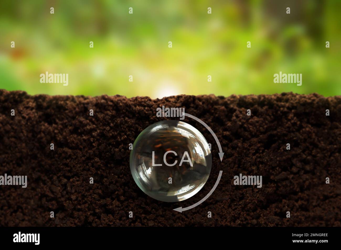 Formula of carbon in a transparent ball underground, on a green ...