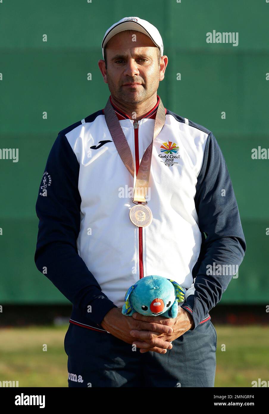 Brian Galea of Malta stands on the podium after he won the bronze medal ...