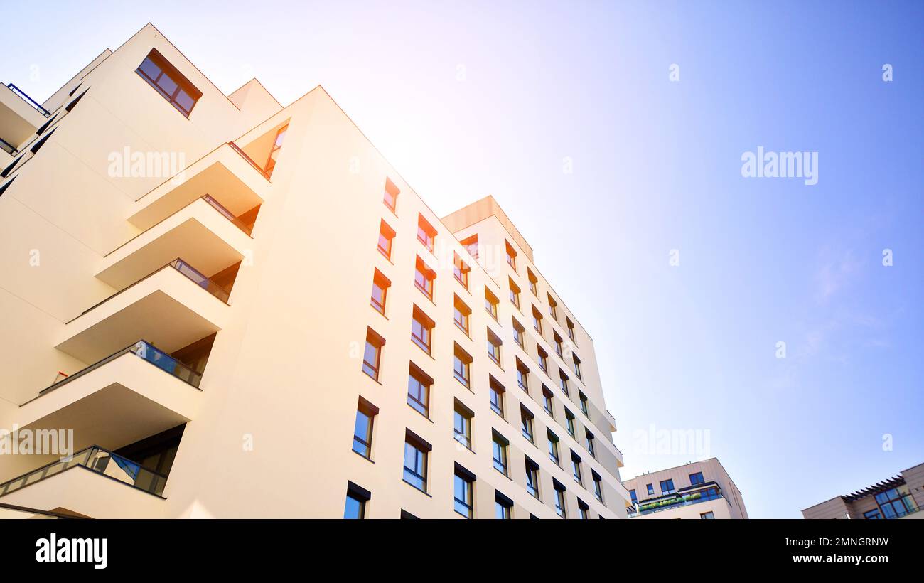 Futuristic square architecture of apartment building. Real estate with ...