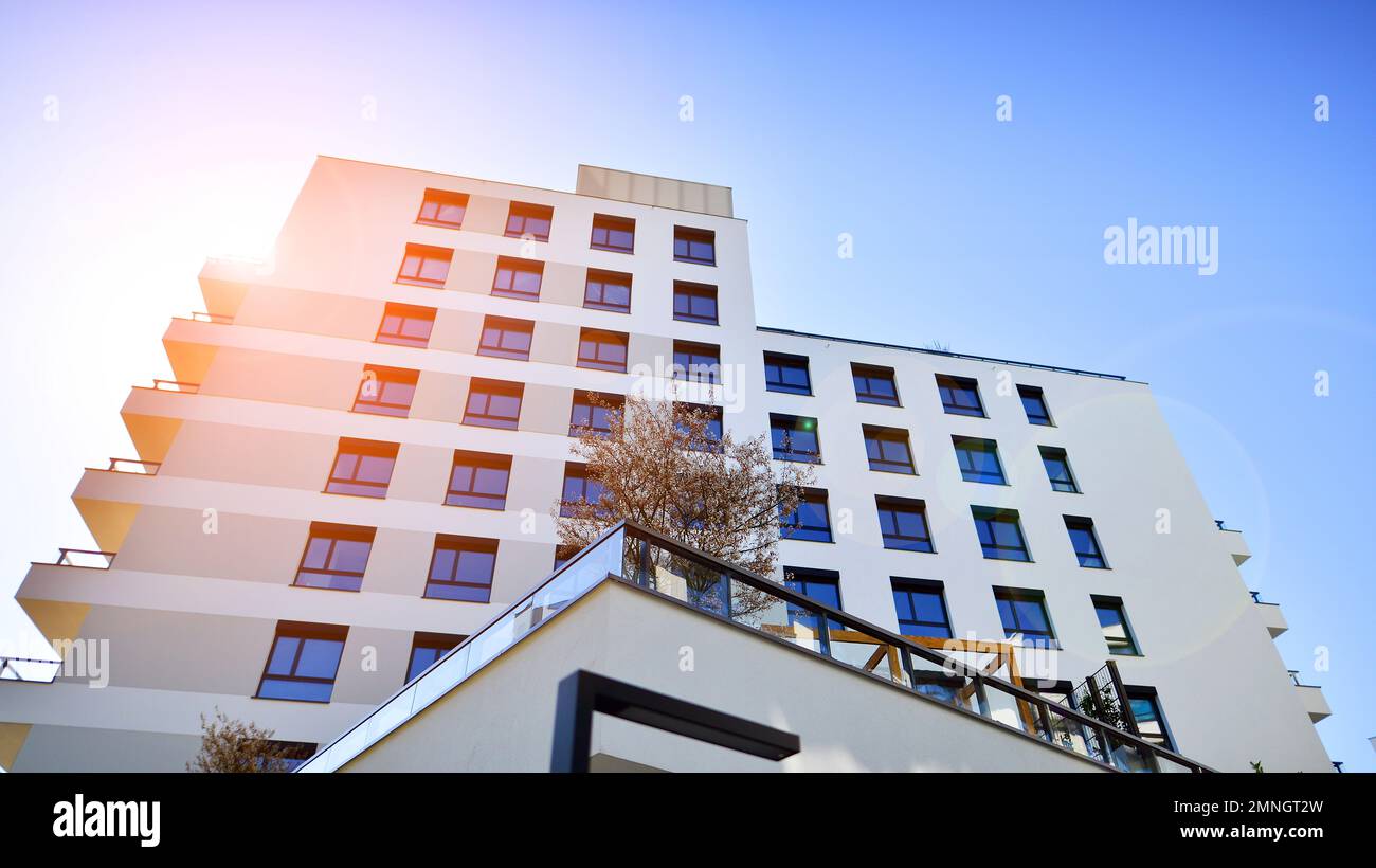 Futuristic square architecture of apartment building. Real estate with ...