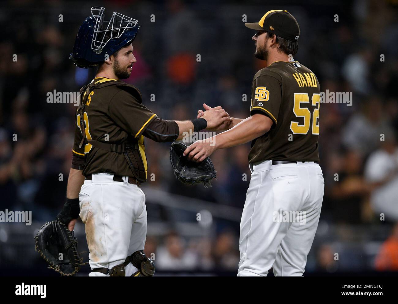 San Diego Padres relief pitcher Brad Hand celebrates with catcher ...
