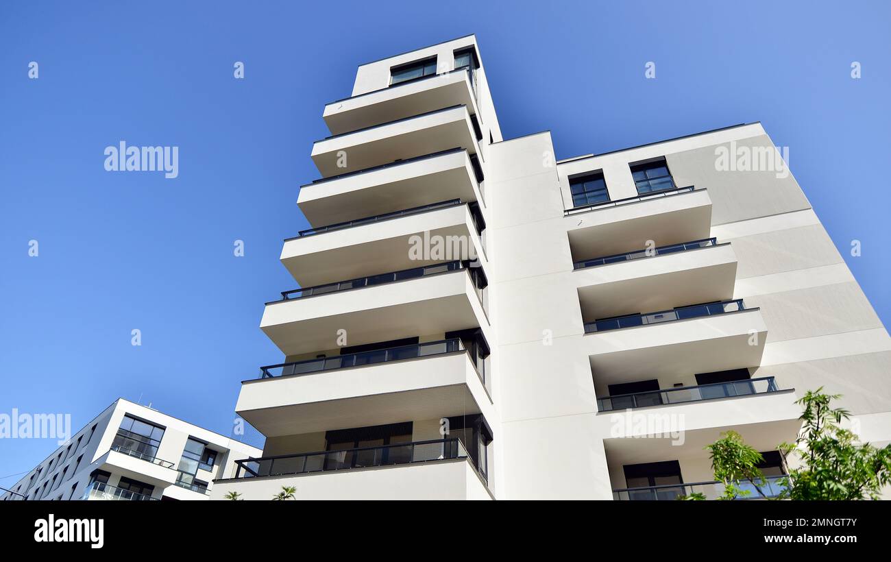 Futuristic square architecture of apartment building. Real estate with ...