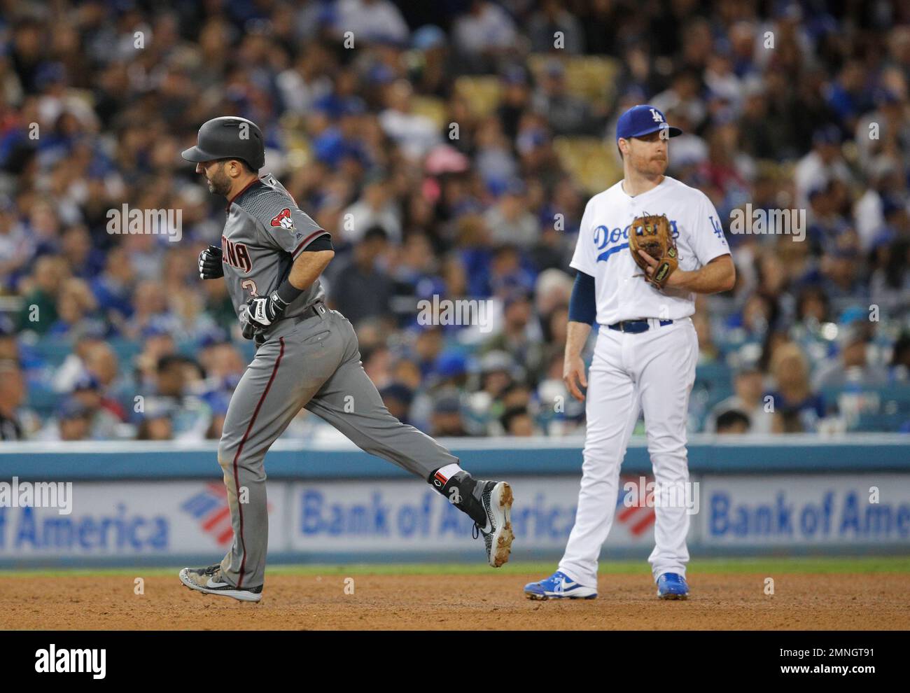 Arizona Diamondbacks' Daniel Descalso, left, rounds the bases after ...