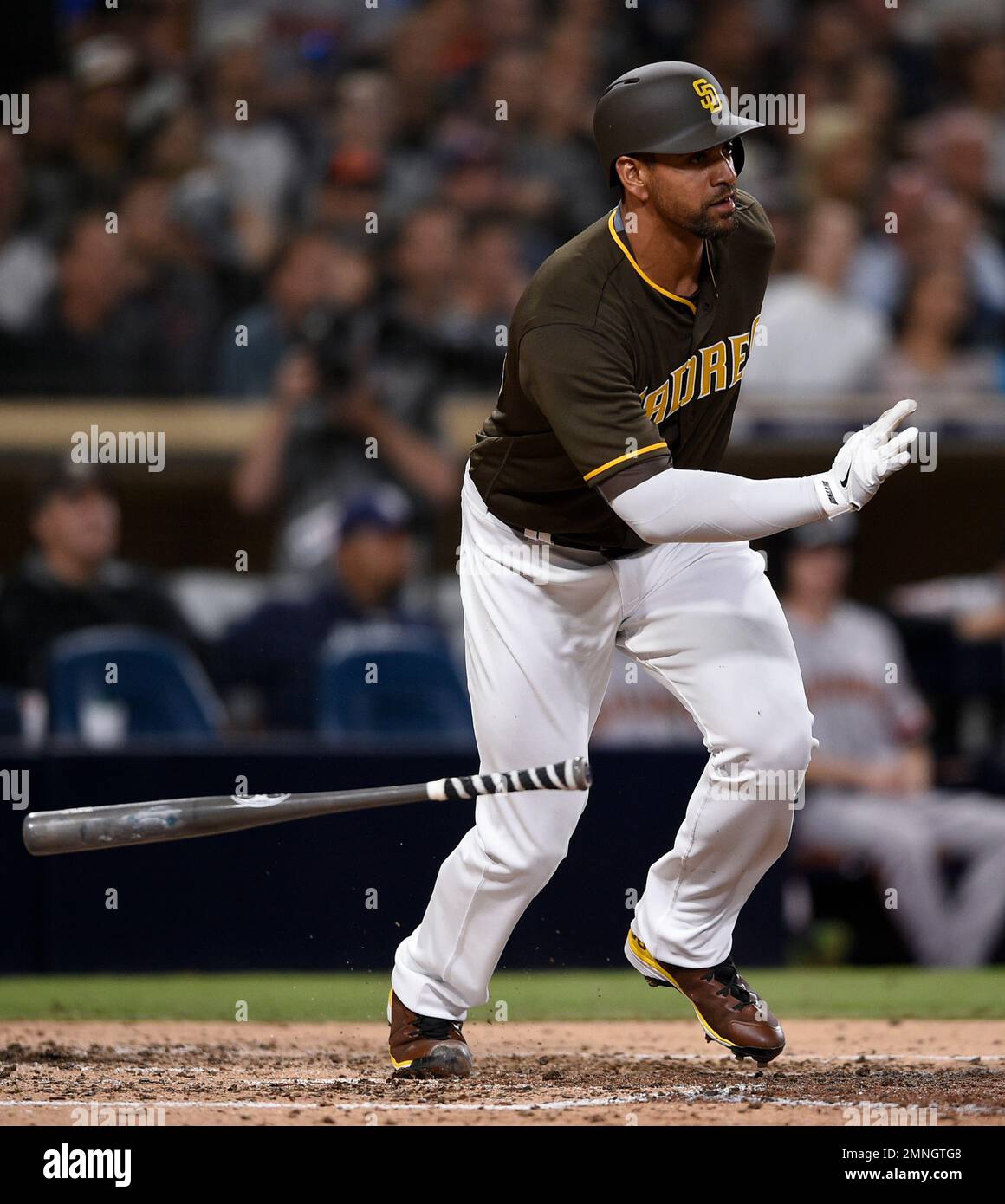 San Diego Padres' Tyson Ross drops his bat after hitting an RBI-single ...