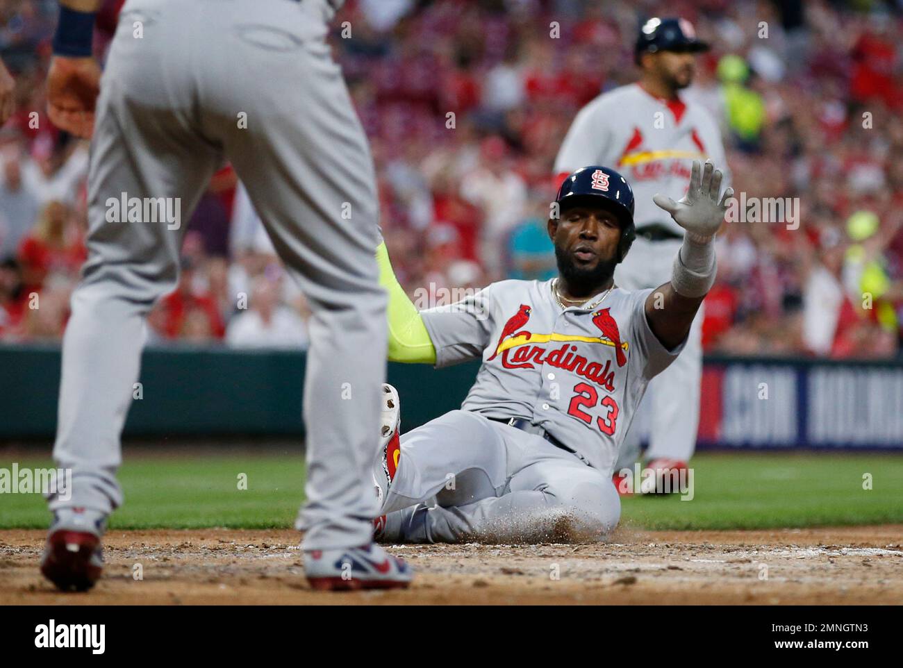 St. Louis Cardinals' Marcell Ozuna (23) scores on a single by Yadier ...