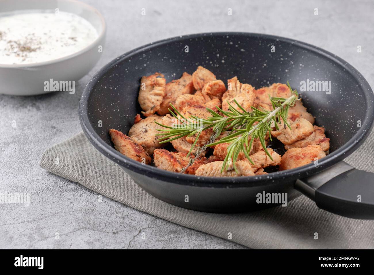 Greek gyros in a frying pan on a gray background Stock Photo - Alamy