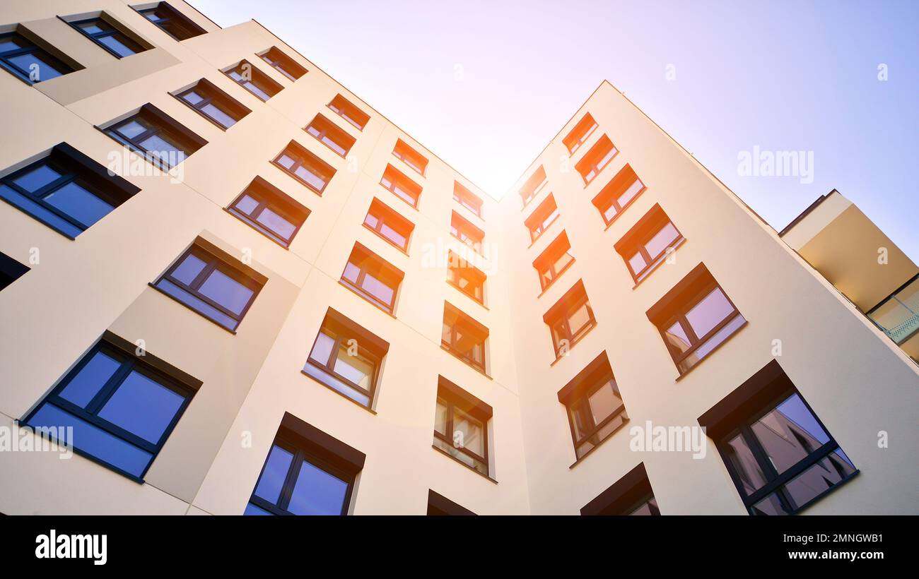 Futuristic square architecture of apartment building. Real estate with ...