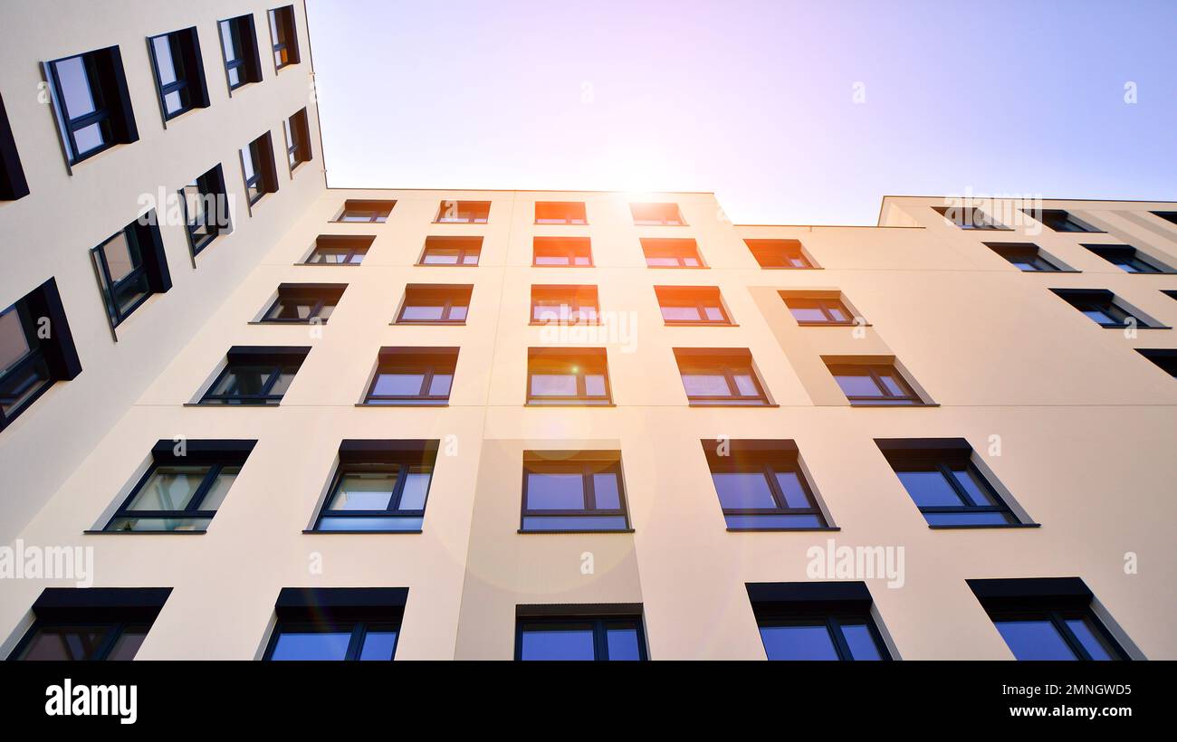 Futuristic square architecture of apartment building. Real estate with ...
