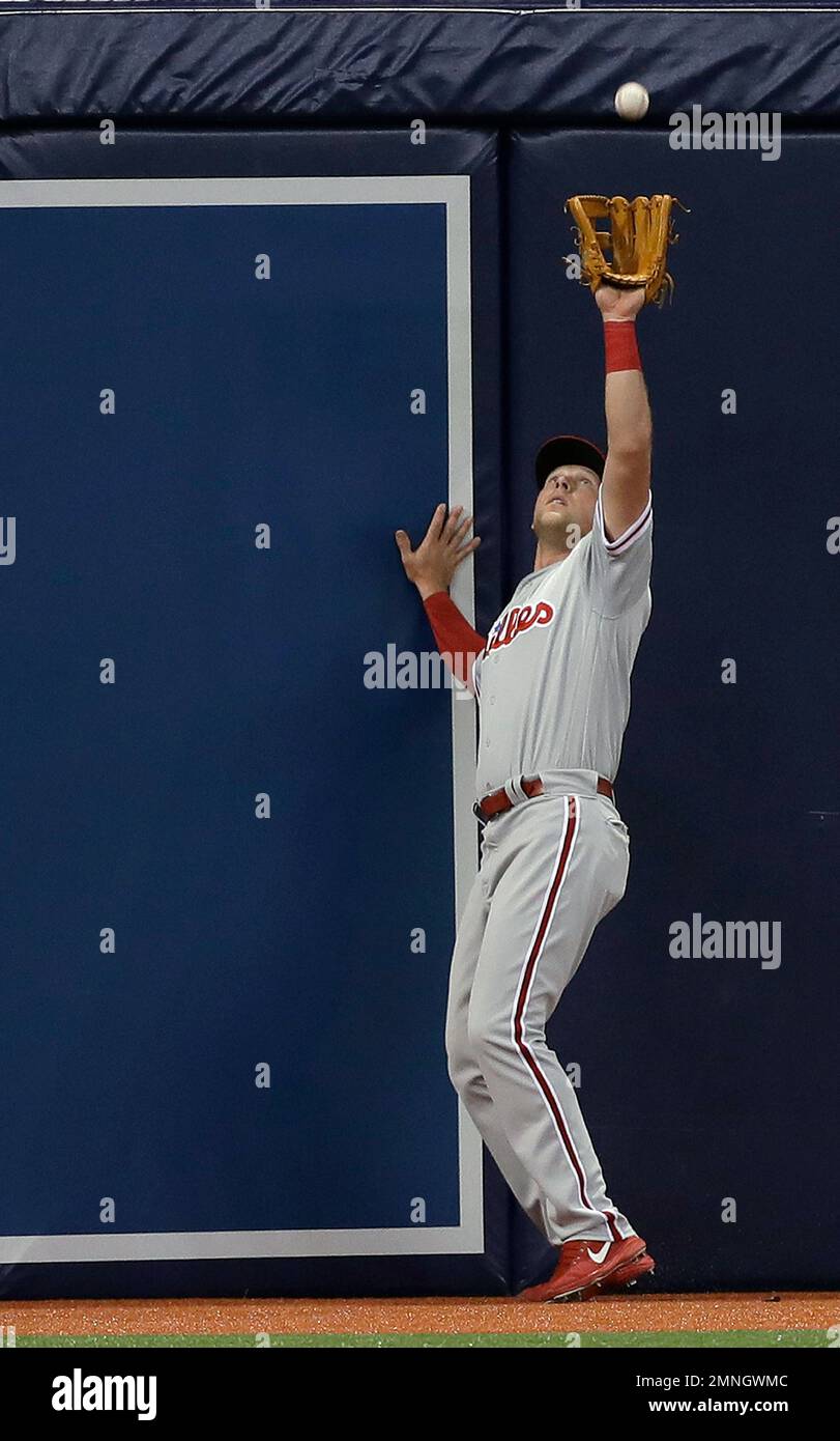 Philadelphia Phillies left fielder Rhys Hoskins makes the catch up ...
