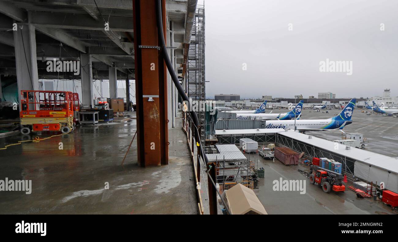 Alaska Airlines planes are shown parked at right, Friday, April 13 ...