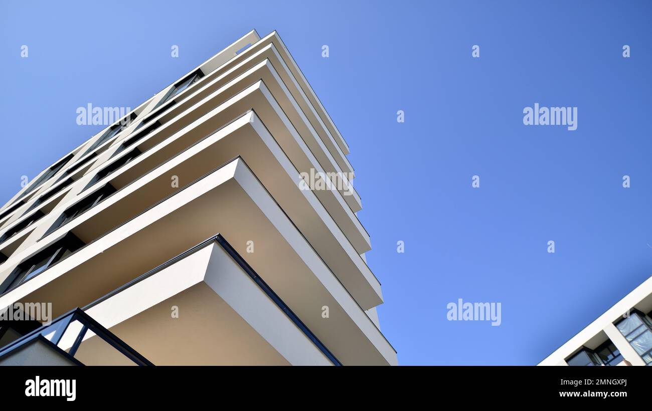 Futuristic square architecture of apartment building. Real estate with ...
