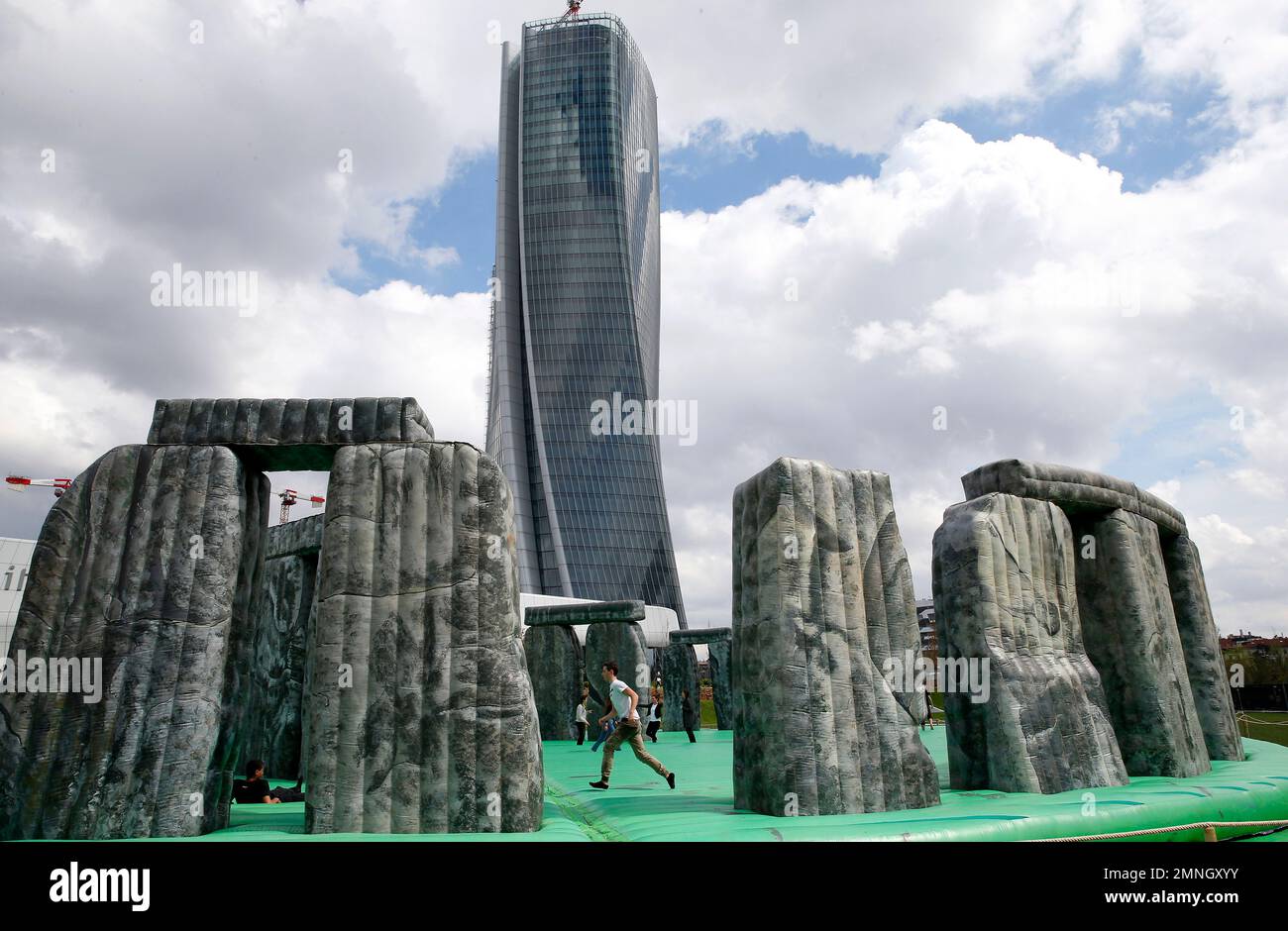 A boy plays on a an inflatable replica of the Neolithic site of ...