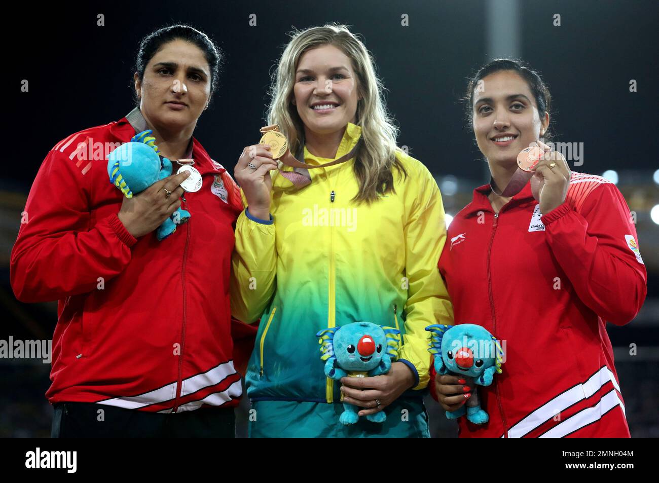 Women's discus gold medalist Australia's Dani Stevens centre, stands ...