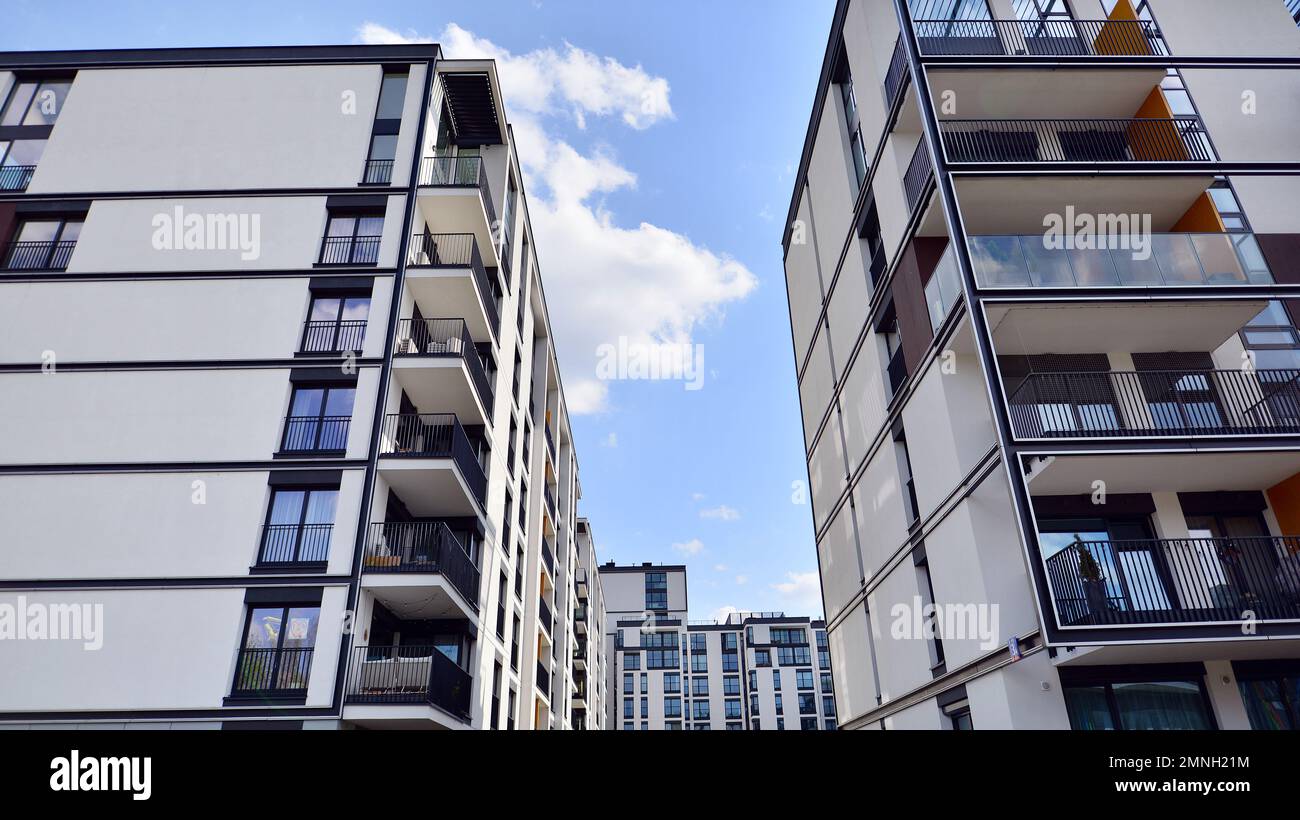 Futuristic square architecture of apartment building. Real estate with ...