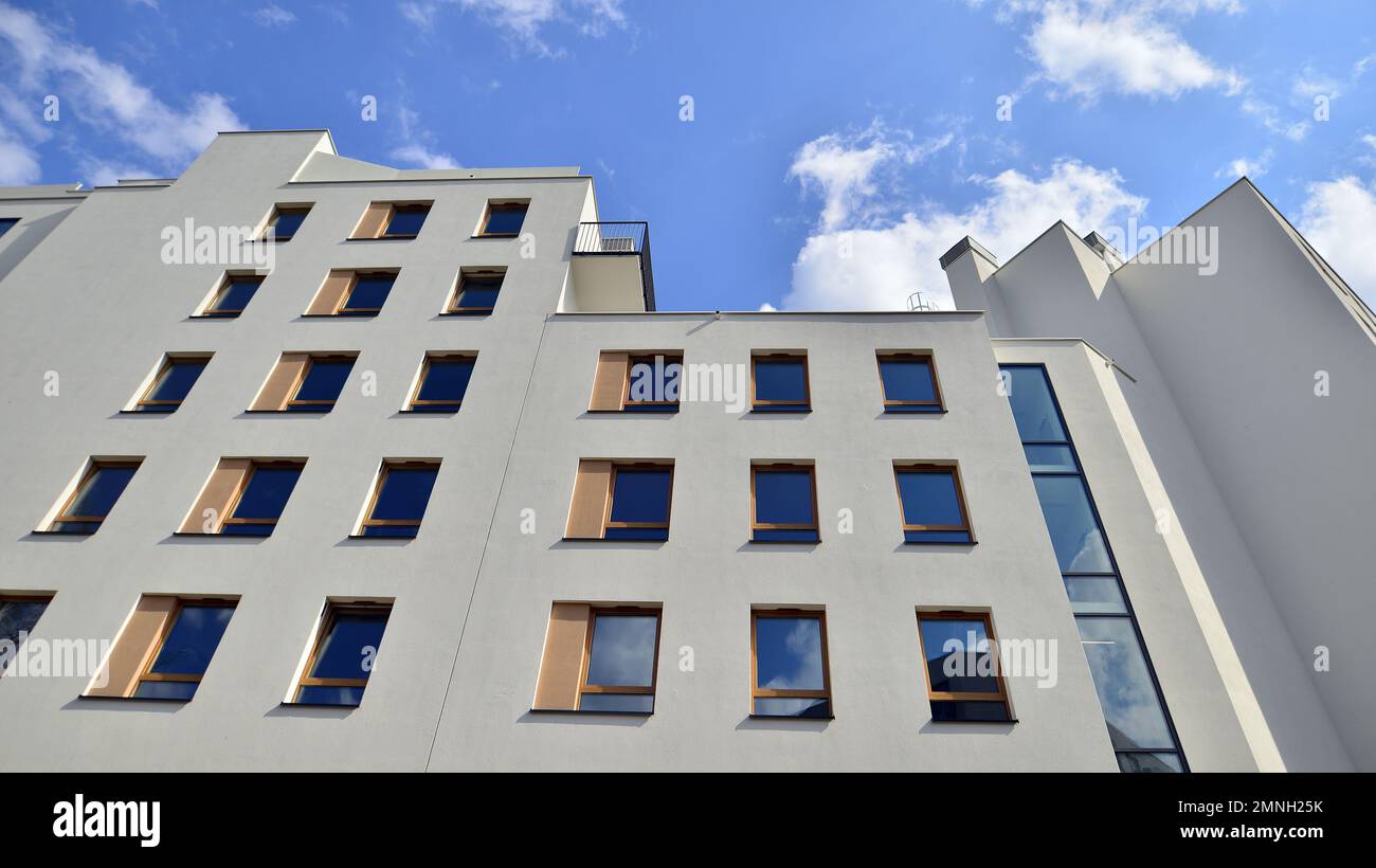 Futuristic square architecture of apartment building. Real estate with ...