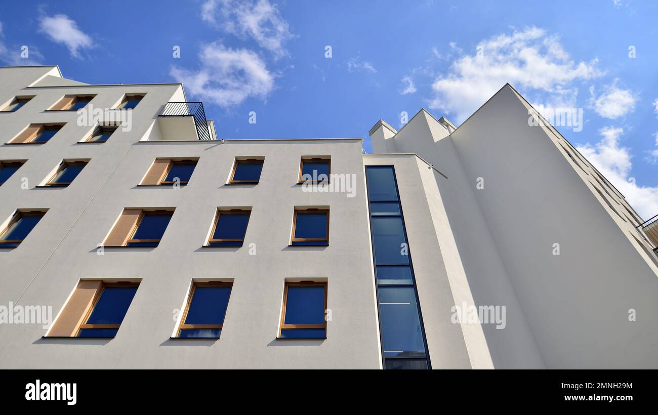 Futuristic square architecture of apartment building. Real estate with ...