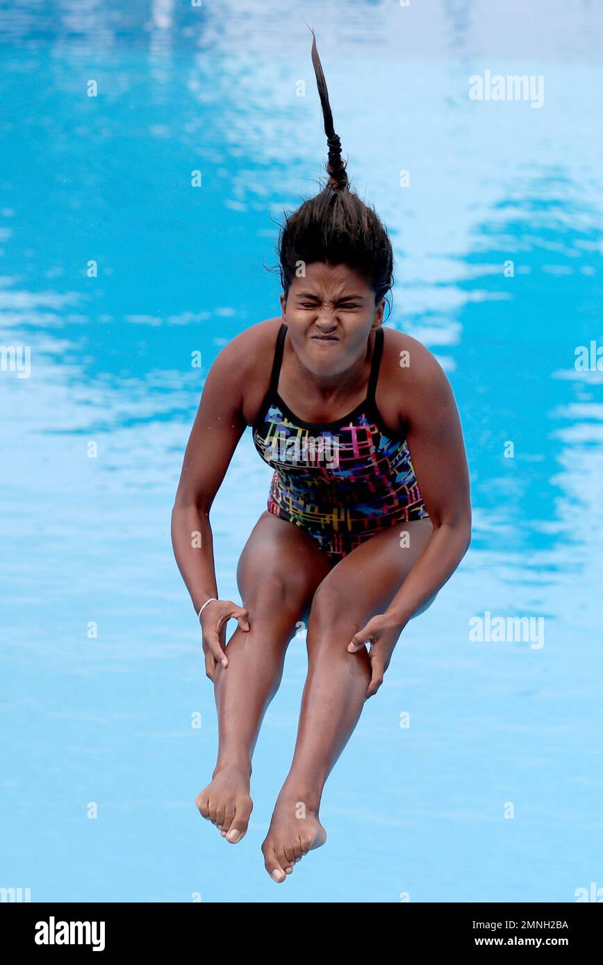 Sri Lanka's Yashoda de Silva makes a dive during the women's 1m springboard preliminary at the ...