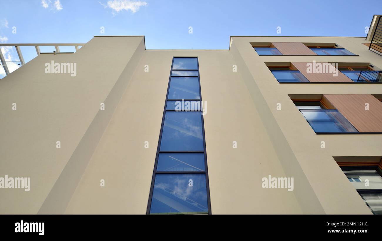 Futuristic square architecture of apartment building. Real estate with ...