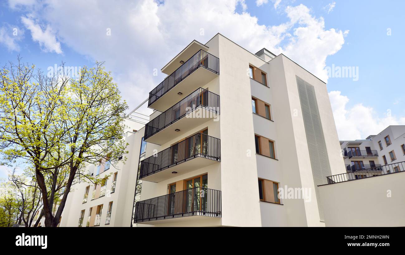 Futuristic square architecture of apartment building. Real estate with ...